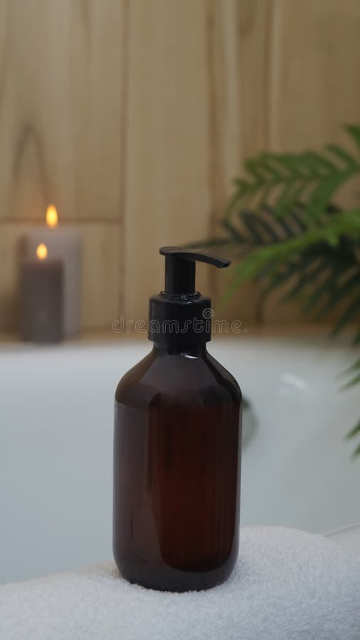 Black Bottle of Bubble Bath and Candles on Tub Indoors Stock Photo ...