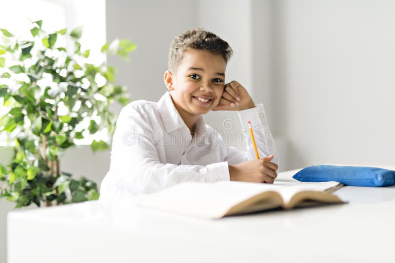 A Cute Black Boy Doing Homework at Home Stock Image - Image of people ...