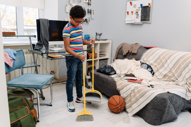 Black Boy in Eyeglasses Sweeping the Floor at Room Stock Photo - Image ...