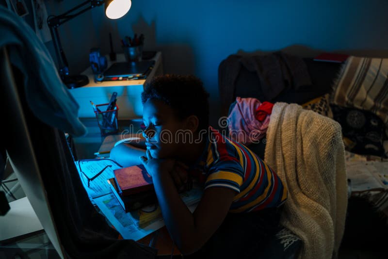 Black Boy Looking at Computer Screen while Doing Homework Stock Image ...