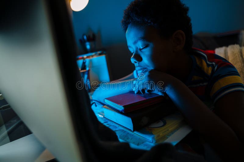 Black Boy Looking at Computer Screen while Doing Homework Stock Image ...