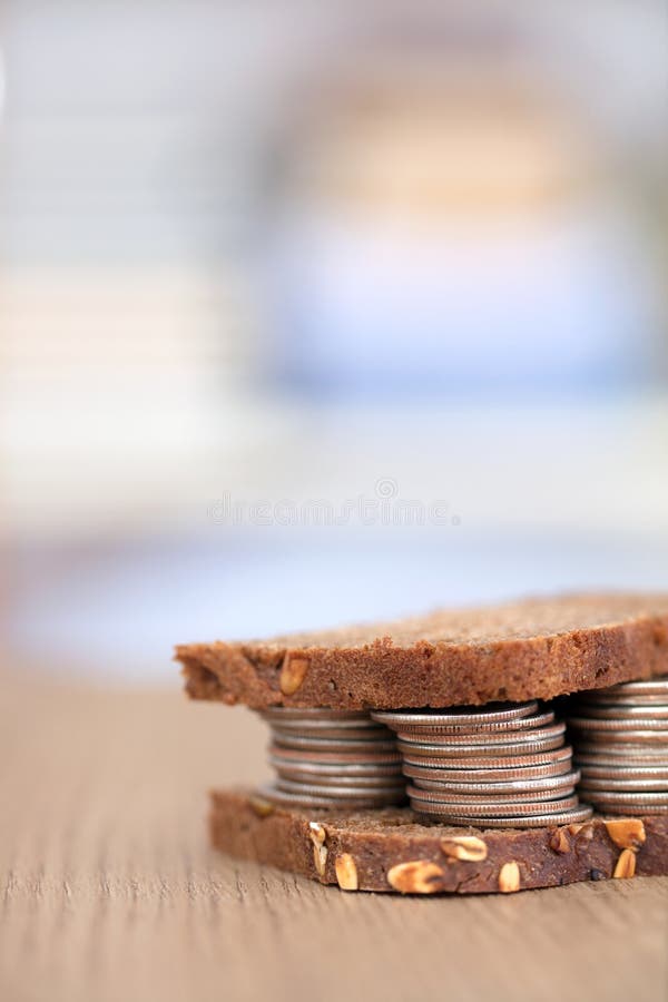 Black Bread with a Lot of Dollar Coins Stock Photo - Image of bread ...