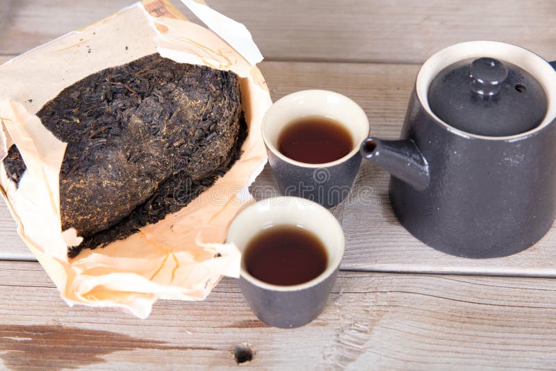 Black Brick Tea and Tea Cup Teapot on the Table Stock Photo - Image of ...