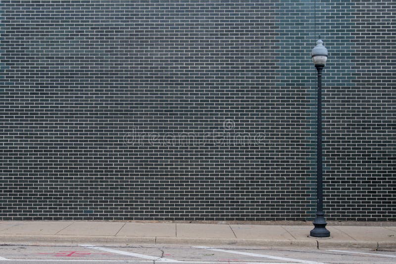 Black Brick Wall with Light Post Stock Image - Image of light, urban ...