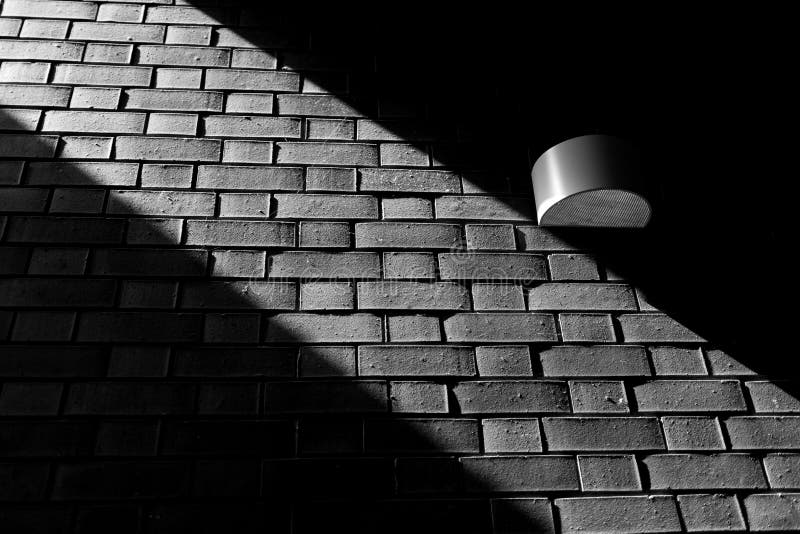 Black Brick Wall Side Light. Stock Image - Image of light, paint: 106371053