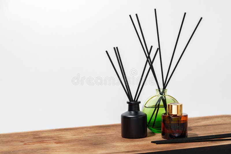 Black and Brown Glass Reed Diffuser Bottles on Wooden Surface Stock ...