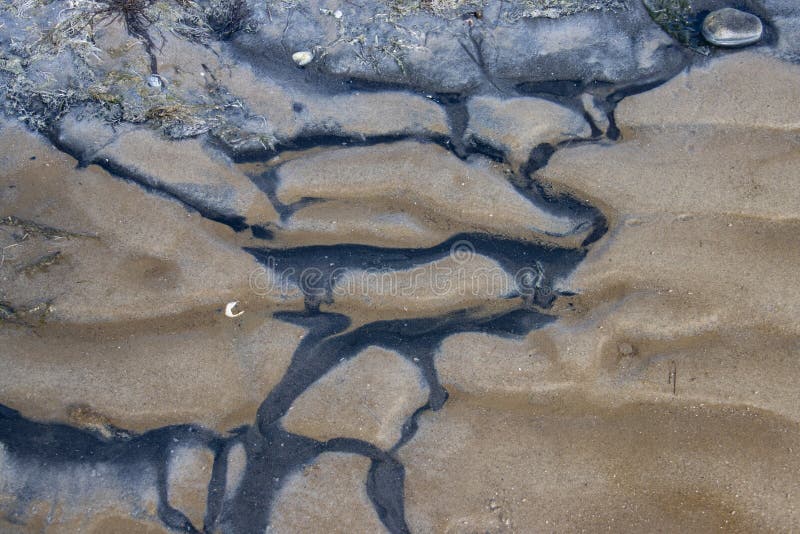 Black and Brown Sand Forming a Natural Pattern during Low Tide in the ...