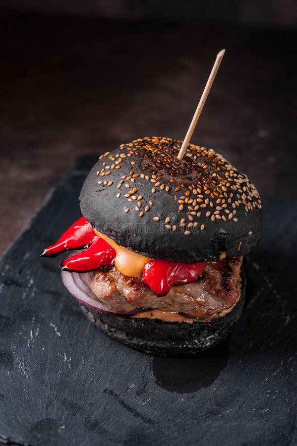 Black Burger with Cheese. Cheeseburger on Dark Background Stock Image ...