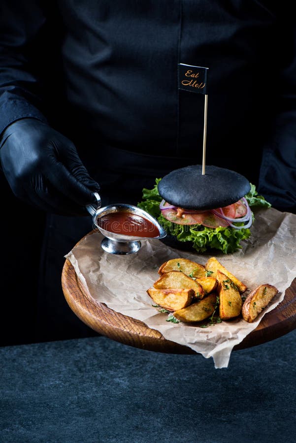 Black Burger on a Wooden Plate Stock Photo - Image of fast, cheese ...