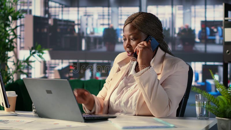 Black Business Director on a Phone Call Discusses Key Business Tasks ... Black Business Director on a Phone Call Discusses Key Business Tasks ...