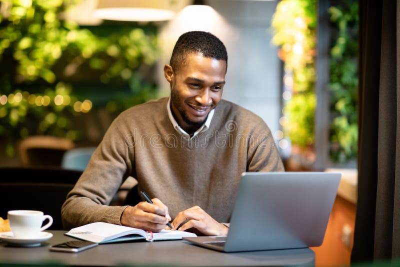 Black Business Guy Taking Notes in Notebook Holding Tablet Stock Image ...