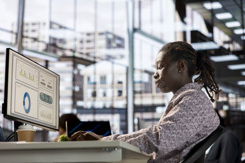 Black Business Manager Engaged in Budget Analysis and Strategy ...