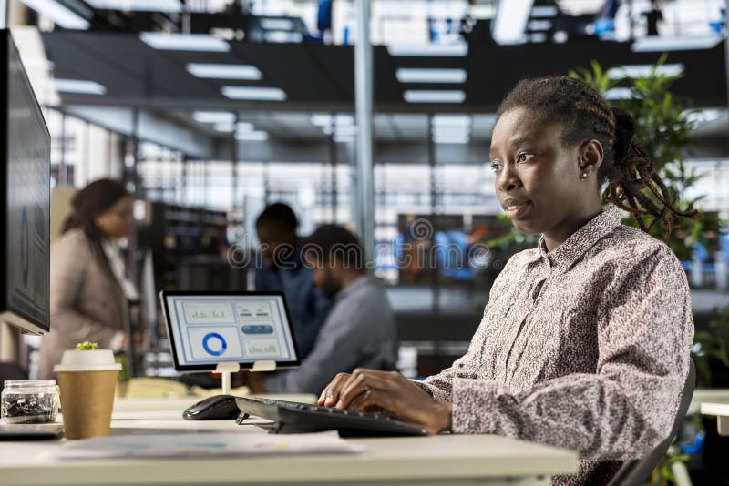 Black Business Manager Engaged in Budget Analysis and Strategy ...