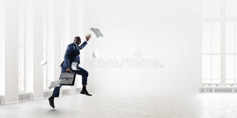 Black Businessman with Briefcase Running among Flying Papers Indoor ...