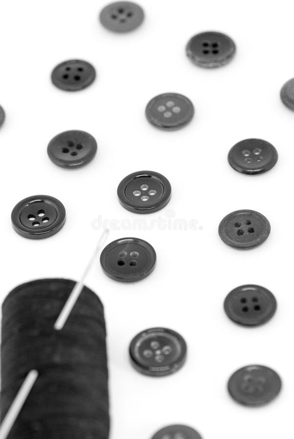 Black Buttons and Black Thread Spool with Needle Elegant Tailoring ...