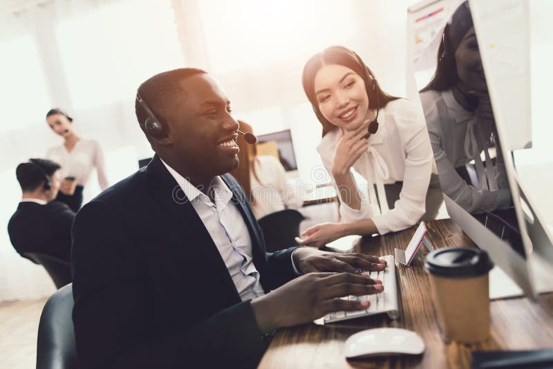 The Black Call Center Operator Looks at the Computer Screen and Laughs ...