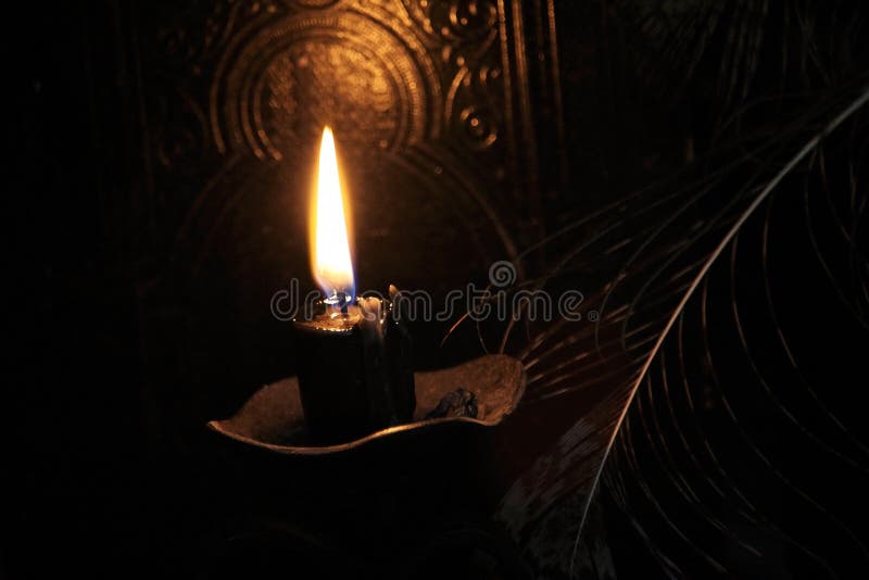 Black candle Magic Ritual stock image. Image of feathers - 80988383