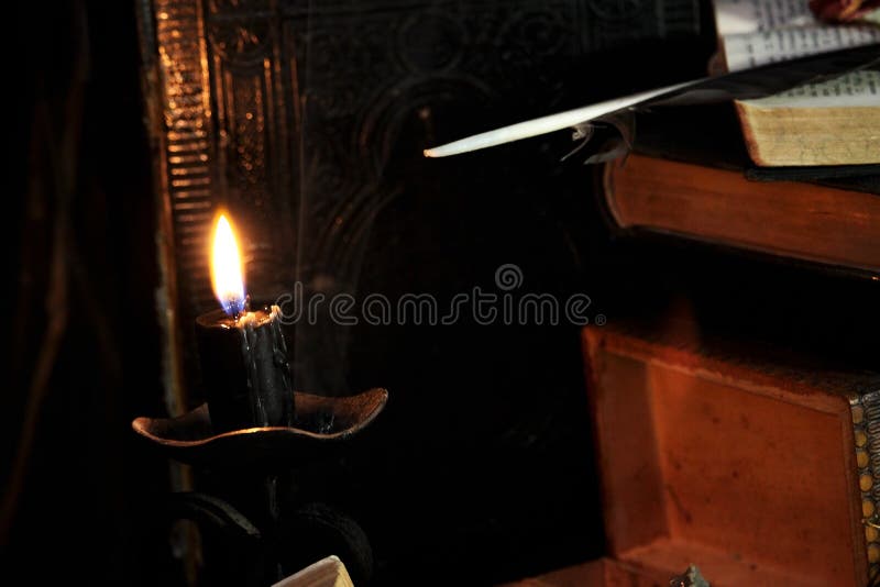 Black candle Magic Ritual stock photo. Image of feathers - 81036360