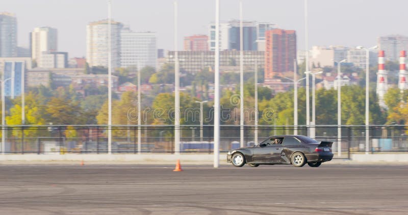 Black Car Drives in Circle, Turning, Avoiding Obstacles on Track Driver ...