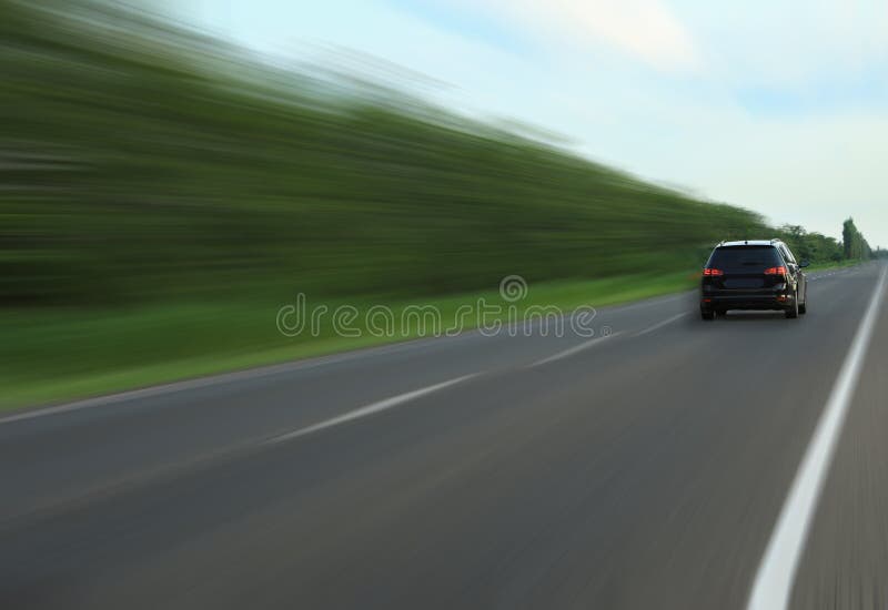 Black Car Driving at High Speed on Asphalt Road Outdoors, Motion Blur ...
