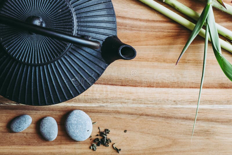 Black Cast Iron Teapot on a Natural Background - Zen Atmosphere Stock ...