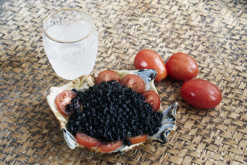 Black caviar and vodka stock photo. Image of refrigerate - 12698282