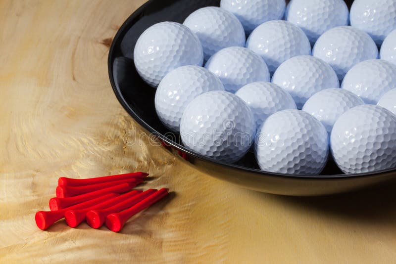 Black Ceramic Bowl Full of White Golf Balls Stock Image - Image of ...