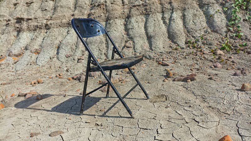 A Black Chair on the Ground Photographed at Eye Level Stock Photo ...