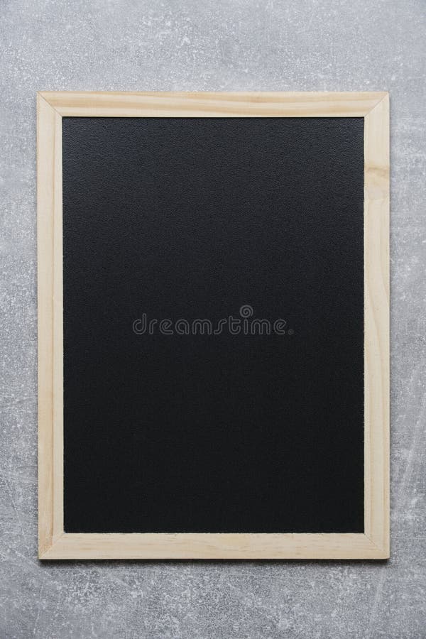 Black Chalkboard for Notes in Wooden Frame Against Gray Concrete Wall ...