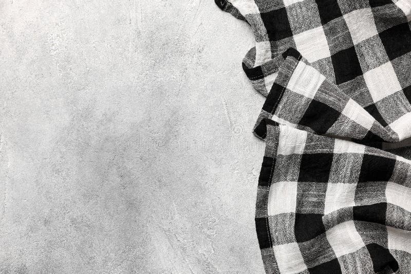 Black Checkered Tablecloth on Light Gray Textured Table, Top View ...