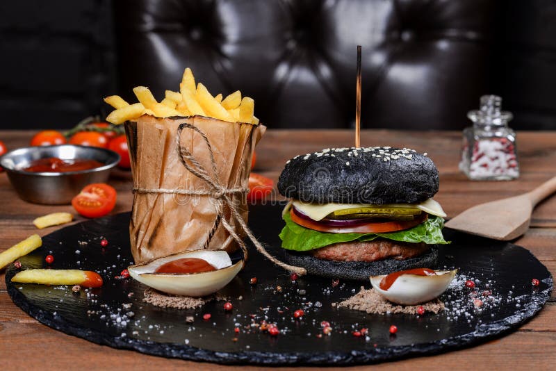 Black Cheeseburger with Cutlet Stock Image - Image of fries, recipe ...
