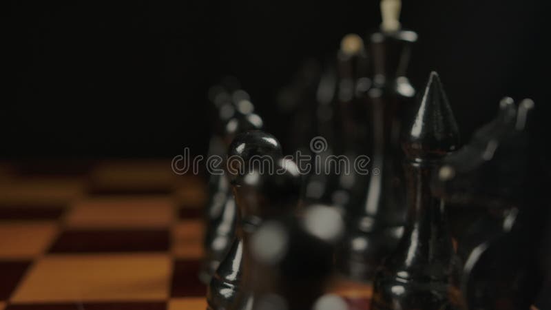 Black Chess Pieces on Board. Camera Tilting and Refocusing Stock Video ...