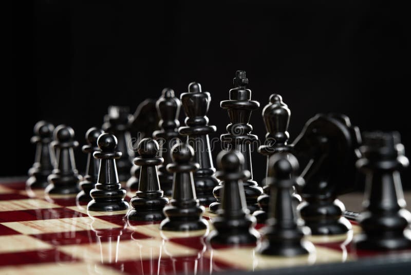 Black Chess Pieces Lined Up in Order at the Beginning of the Game on a ...