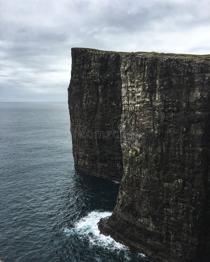 Black Cliffs Formation in the Atlantic Ocean, Faroe Islands. Towering ...