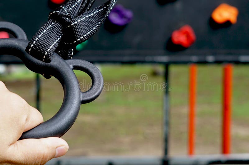 A Black Climbing Rings in Hand for Exercise of a Sport Equipment Stock ...