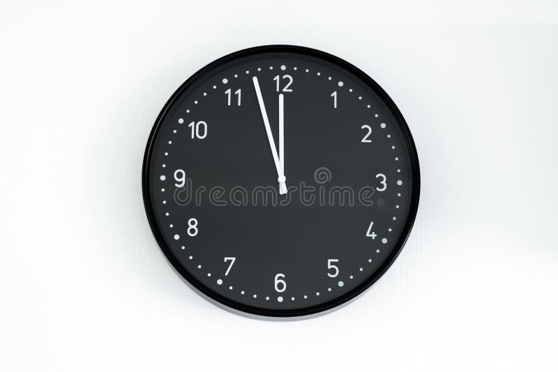 Black clock on wall stock image. Image of closeup, tick - 152404061