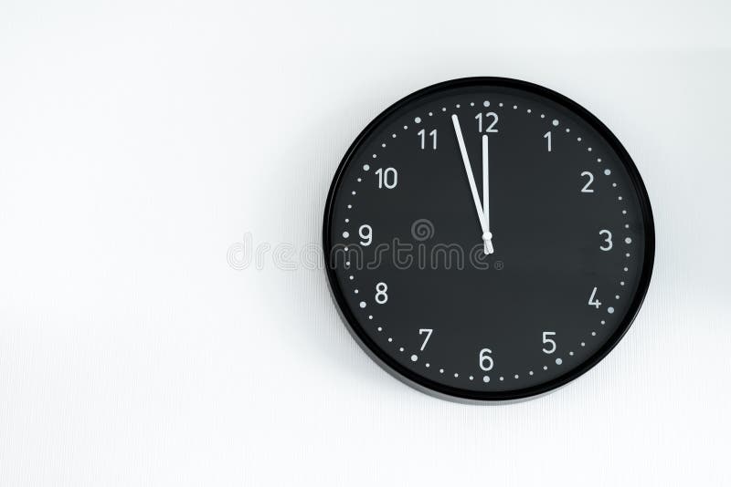 Black clock on wall stock photo. Image of hand, symbol - 152634380