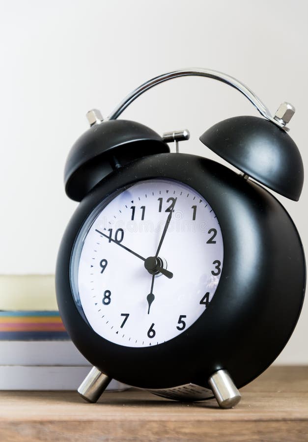 Black clock on wall stock image. Image of closeup, tick - 152404061