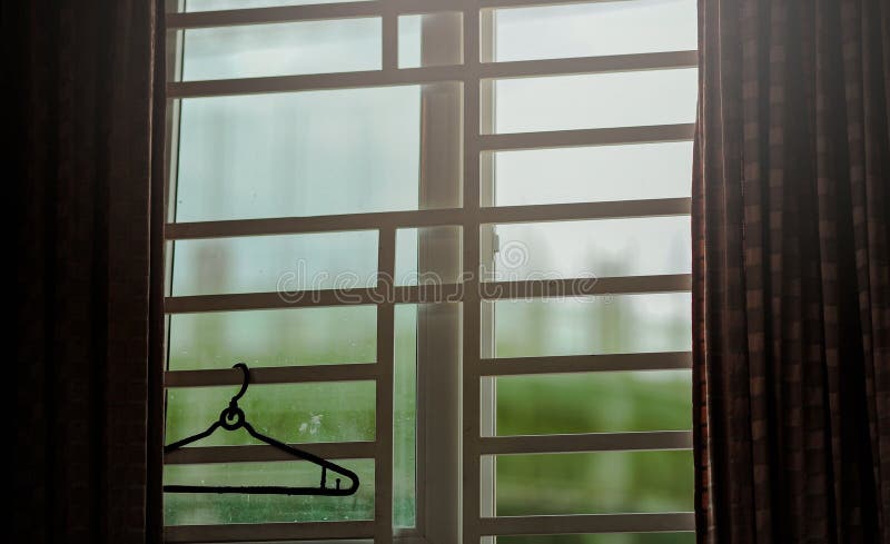 Black Clothes Hanger Hanged on Window Stock Photo - Image of ...