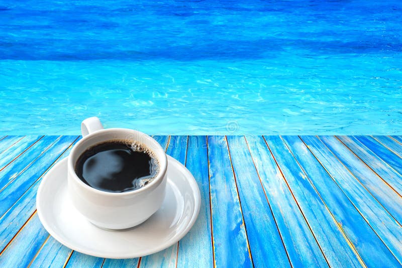 Black Coffee in Cup on a Wooden Table and Beautiful Sea Stock Image ...