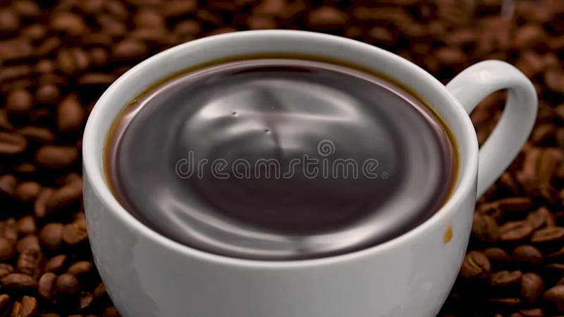 Black Coffee Drop Dripping in a Cup of Coffee. Stock Footage - Video of ...