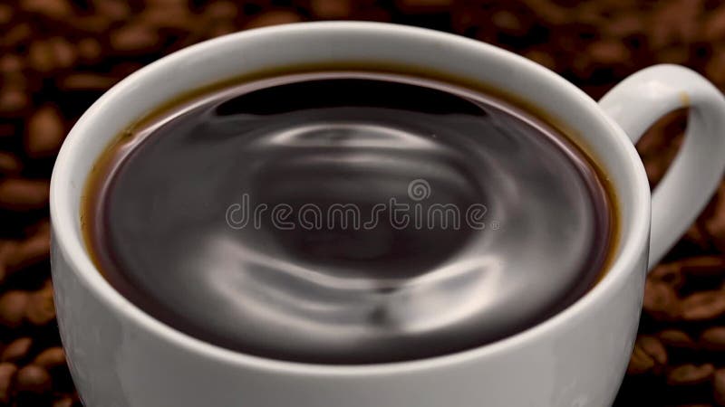 Black Coffee Drop Dripping in a Cup of Coffee, Coffee Beans Stock Video ...