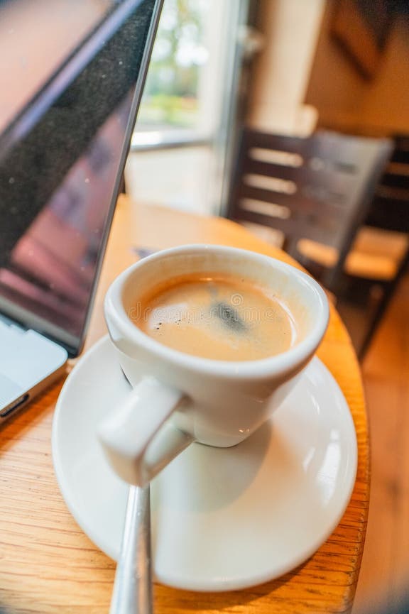 Black Coffee in an Espresso Mug on a Table in a Coffee Shop during Work ...