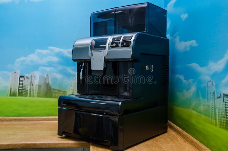 Black Coffee Machine On A Table In An Office Stock Photo - Image of ...