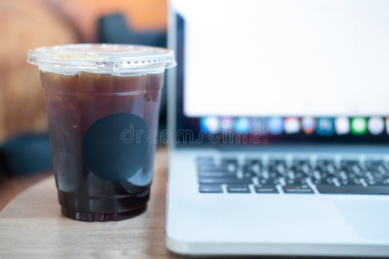 Black Coffee in Plastic Cup with Computer Laptop Stock Photo - Image of ...