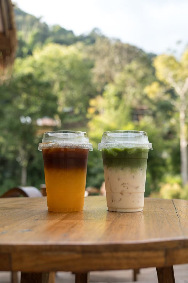 Black Coffee Separate Layer with Orange Juice and Green Tea Separate ...