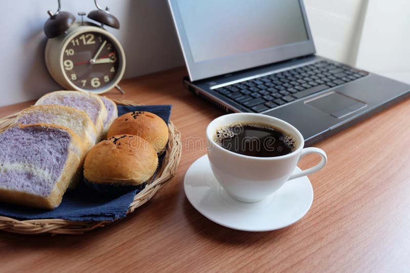 Black Coffee in a White Cup, Bread, and Laptop Computer Stock Photo ...