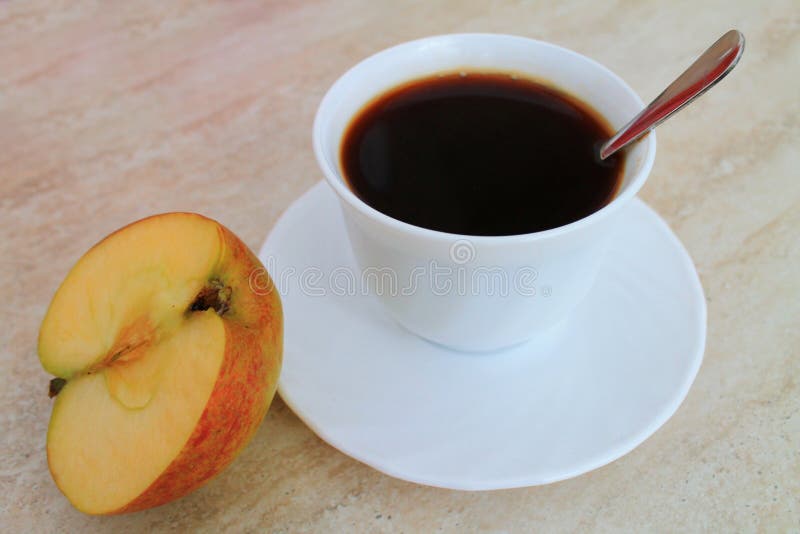 Black Coffee in a White Cup with Half an Apple. Breakfast with Coffee ...