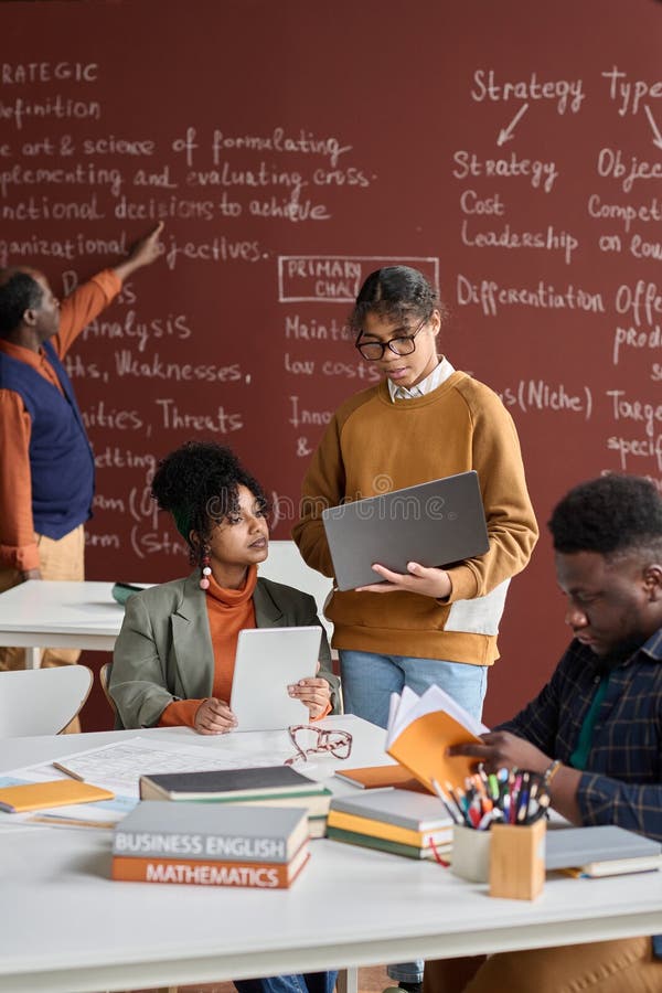 Black College Students Doing Group Study in Class with Blackboard in ...