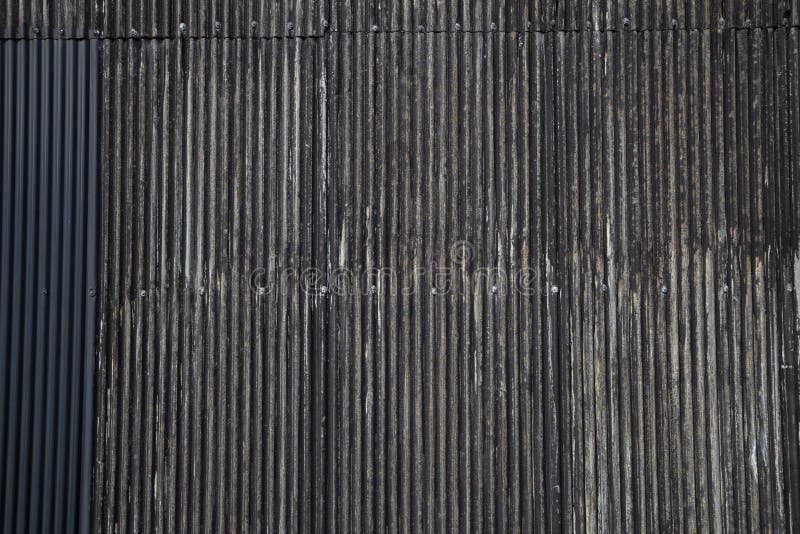 Black Color Old Rusty Wavy Metal Plate Wall Stock Photo - Image of ...